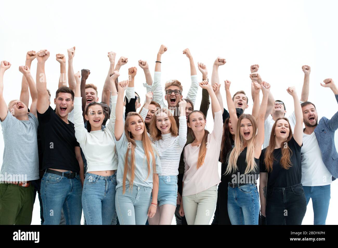 happy group of young people with hands up Stock Photo - Alamy