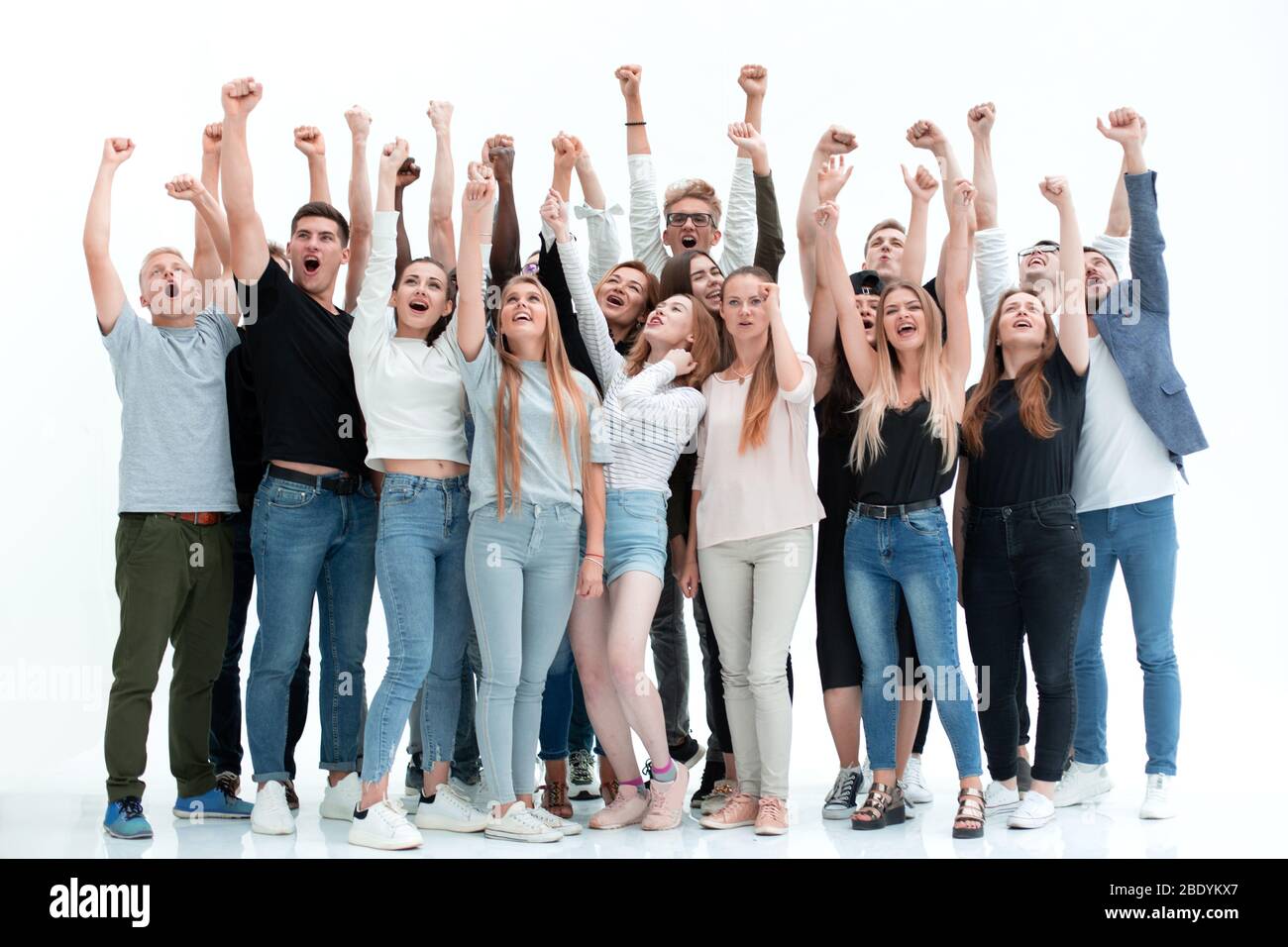 happy group of young people with hands up Stock Photo - Alamy