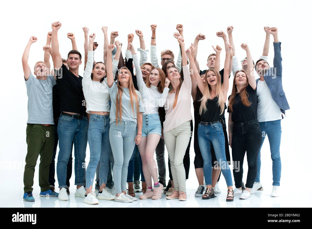 happy group of young people with hands up Stock Photo - Alamy