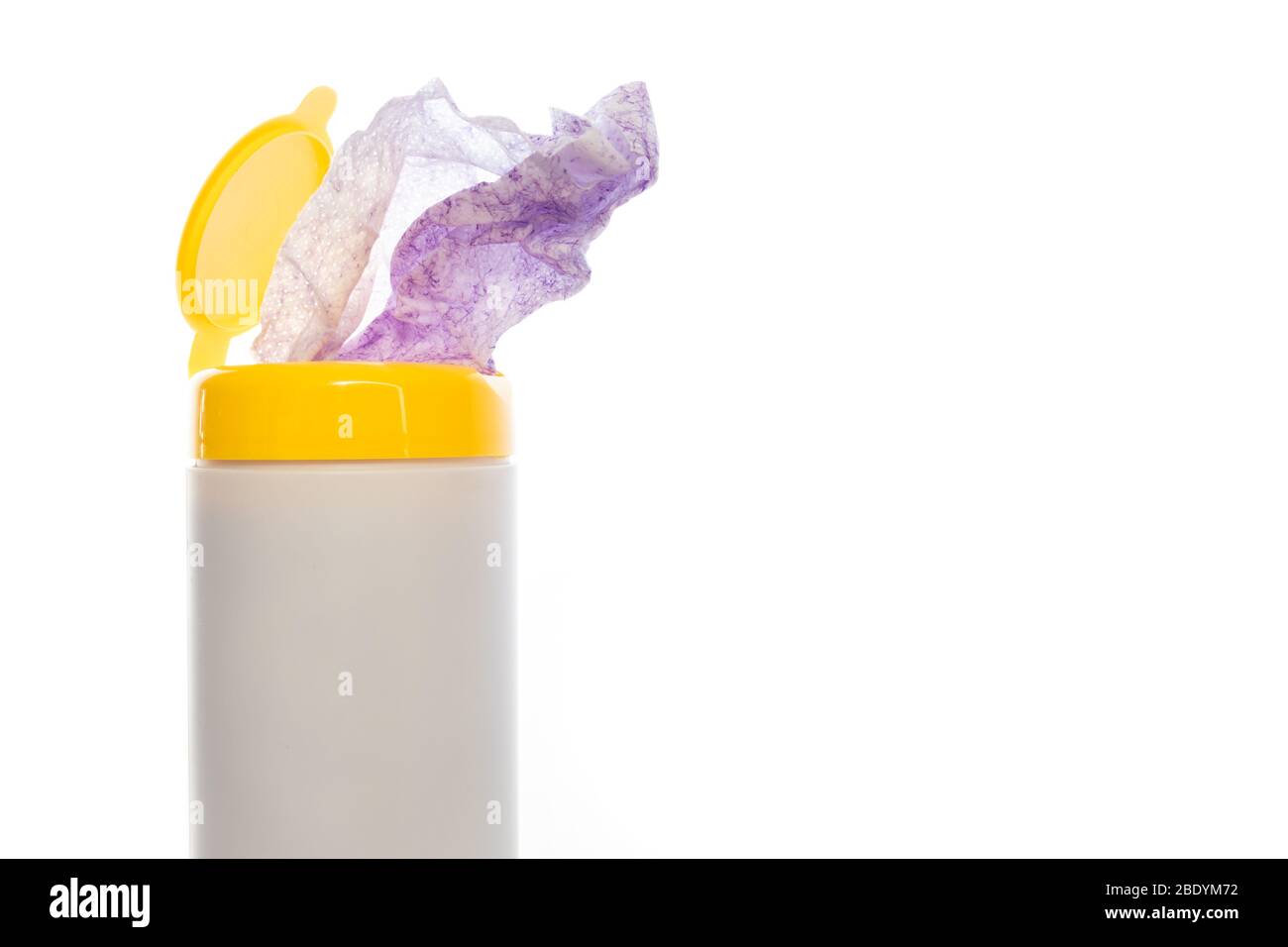 Sanitizing wipe coming out of the lid of the container on a white ...