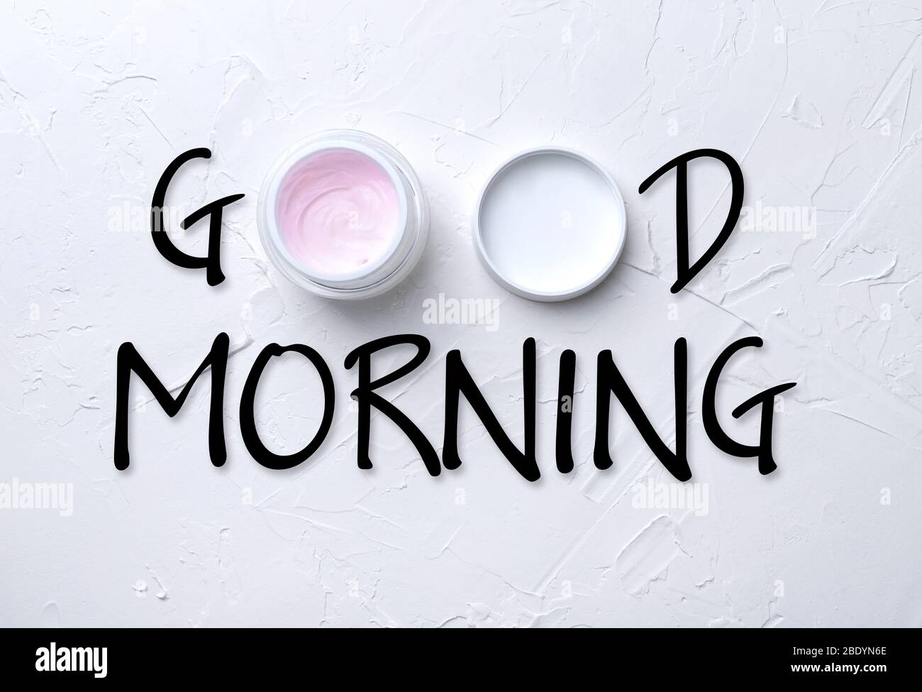 Text Good morning and cosmetics cream on white background Stock Photo ...