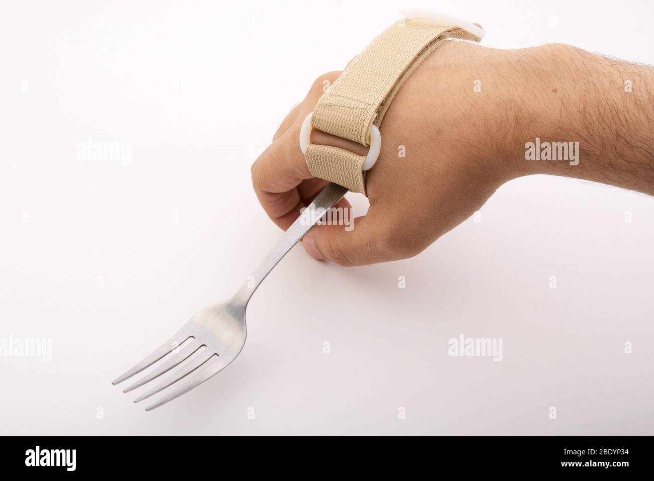 Hand Holding Eating Assist Device, Fork Stock Photo - Alamy