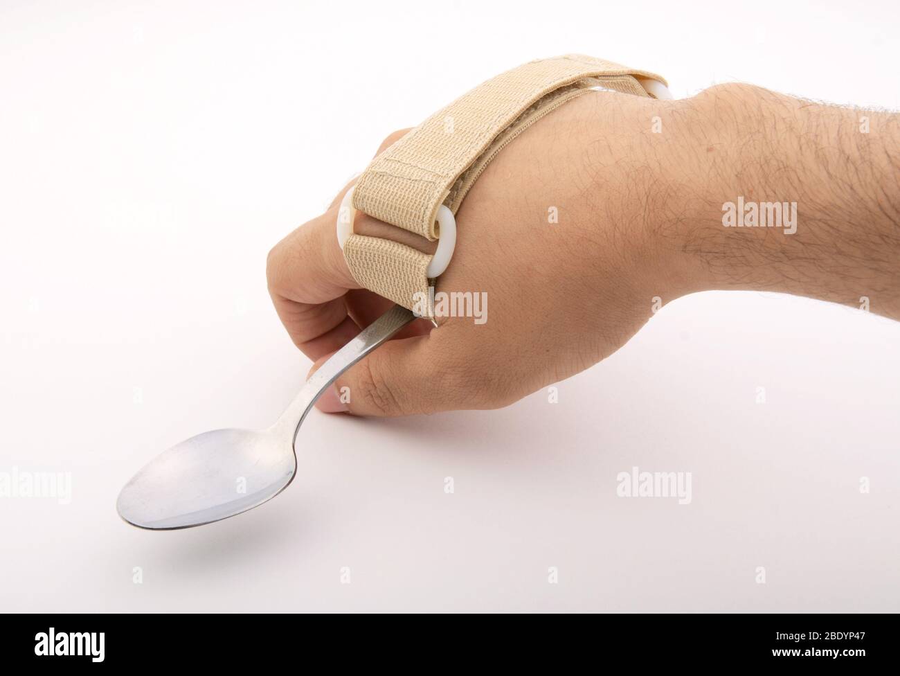 Hand Holding Eating Assist Device, Spoon Stock Photo - Alamy