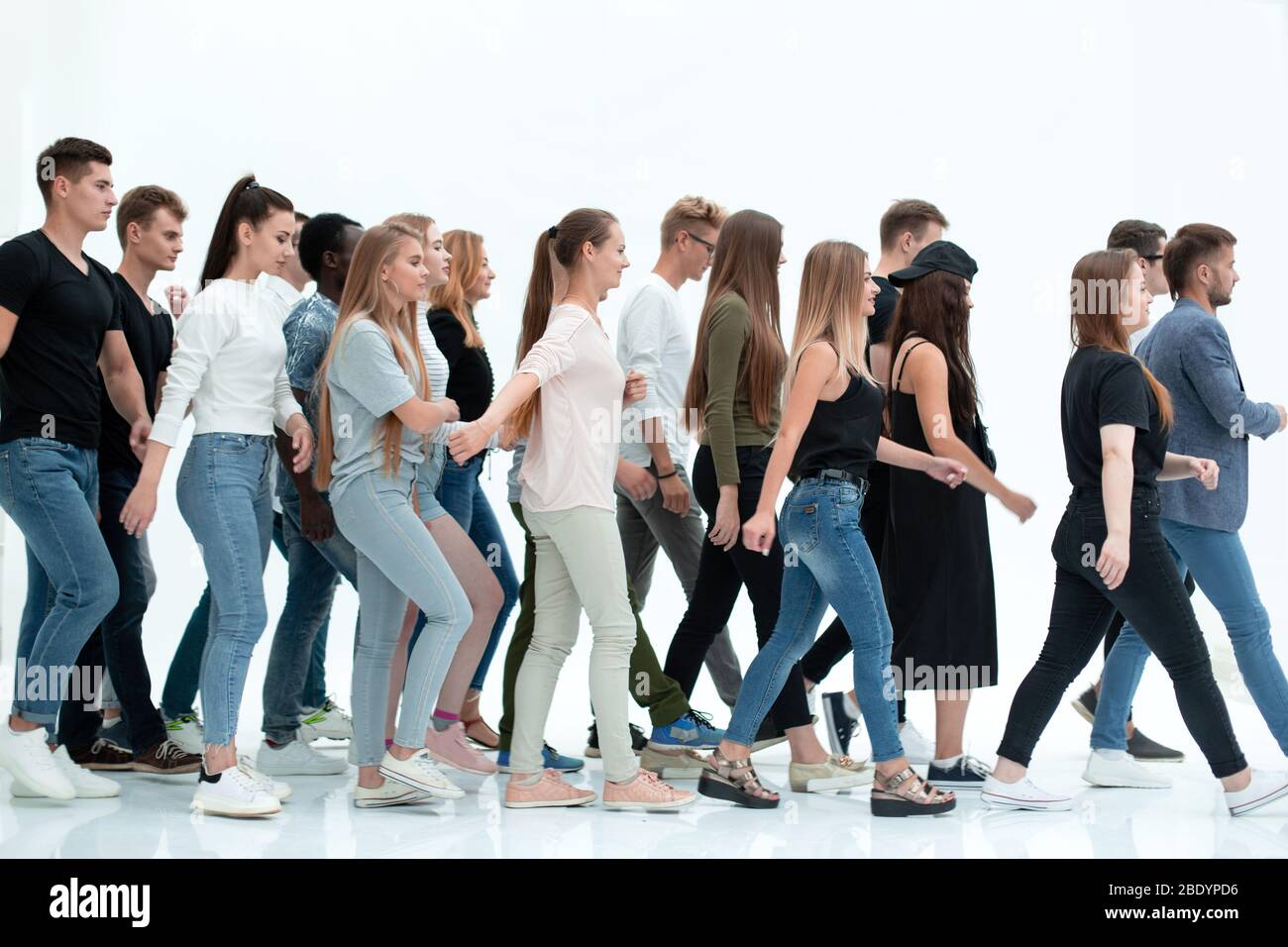 side view. a group of young people going forward Stock Photo - Alamy
