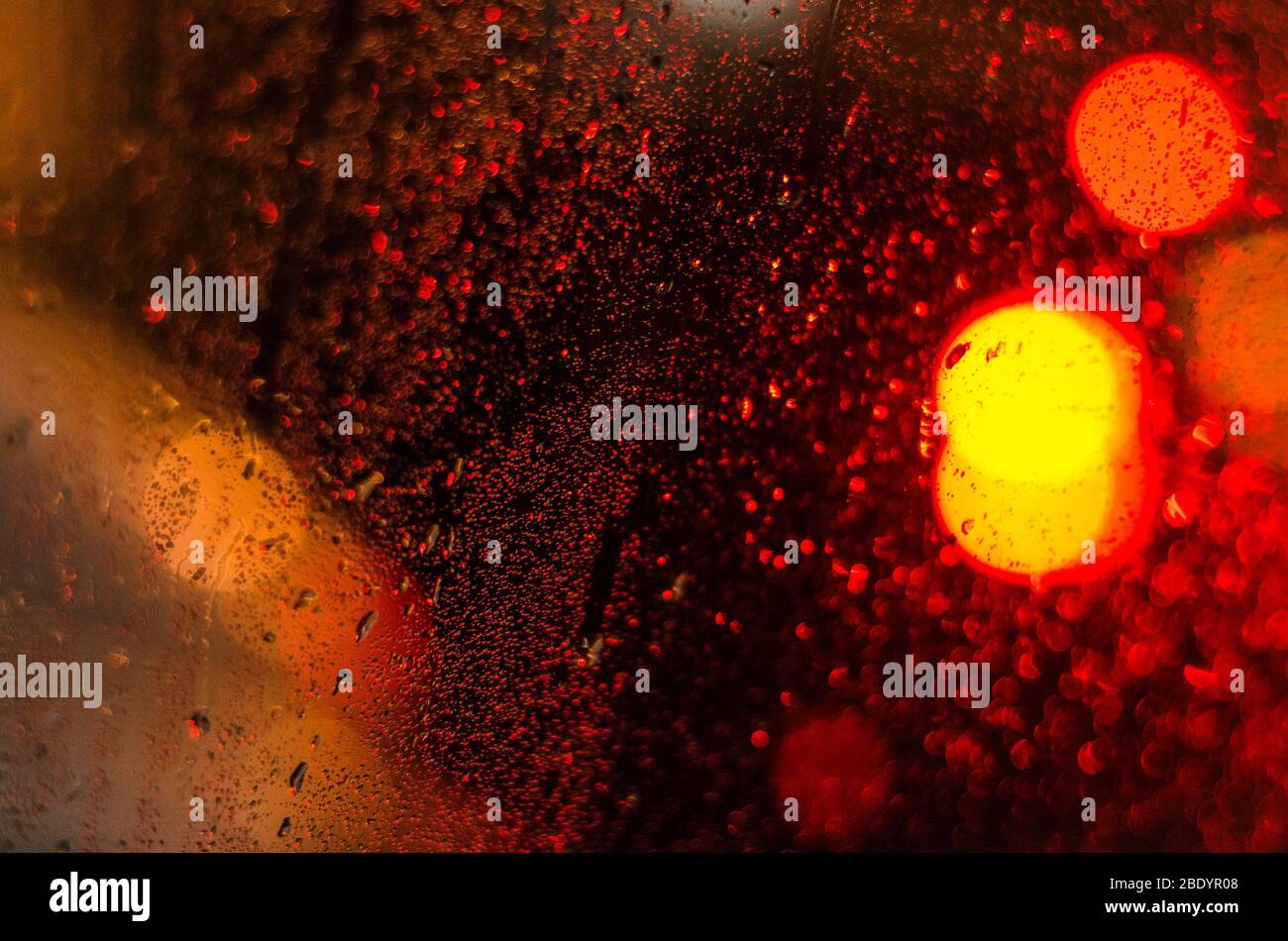 Raindrops on the glass window at night Stock Photo - Alamy