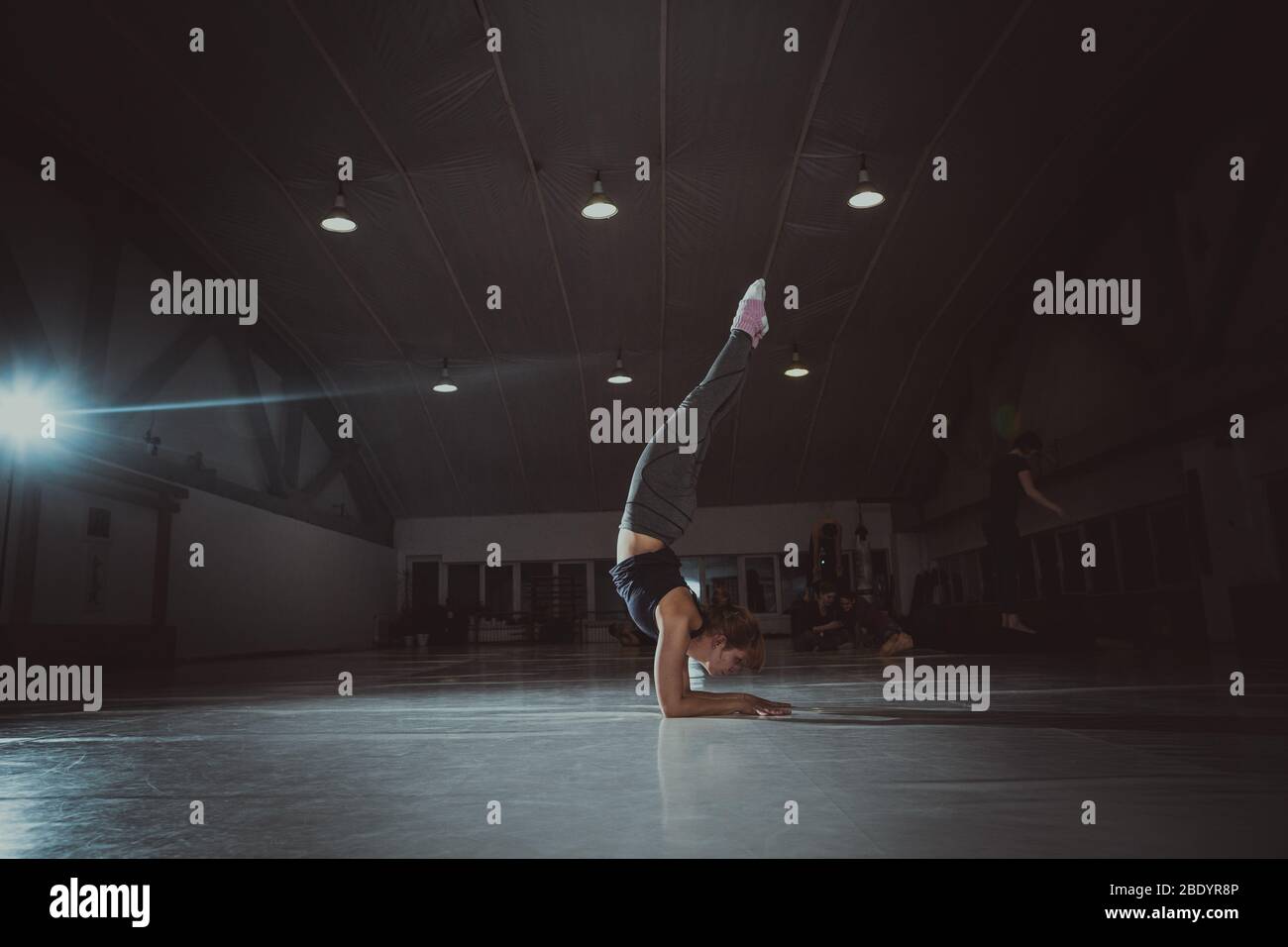 Supported Headstand Yoga Pose. Young yogi woman doing yoga headstand ...