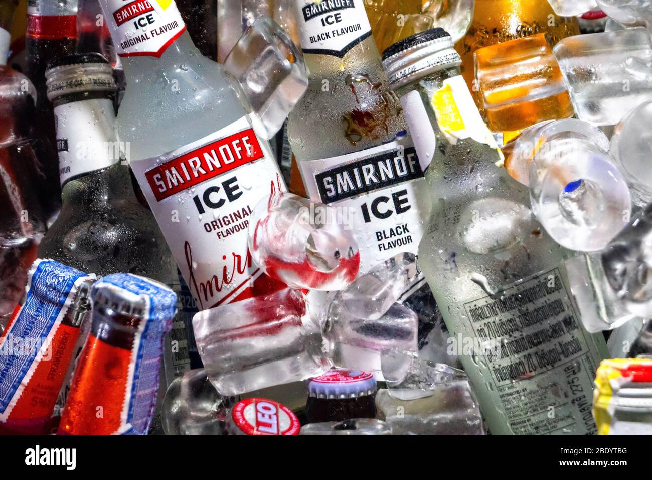 Close-up of a bottle of alcohol in a box with ice. Smirnoff vodka is ...
