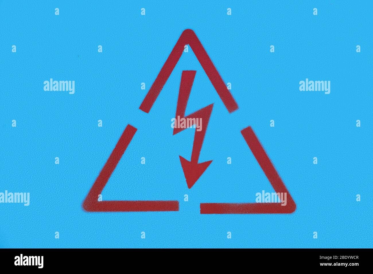 close up photography of a red painted electricity warning sign on a ...