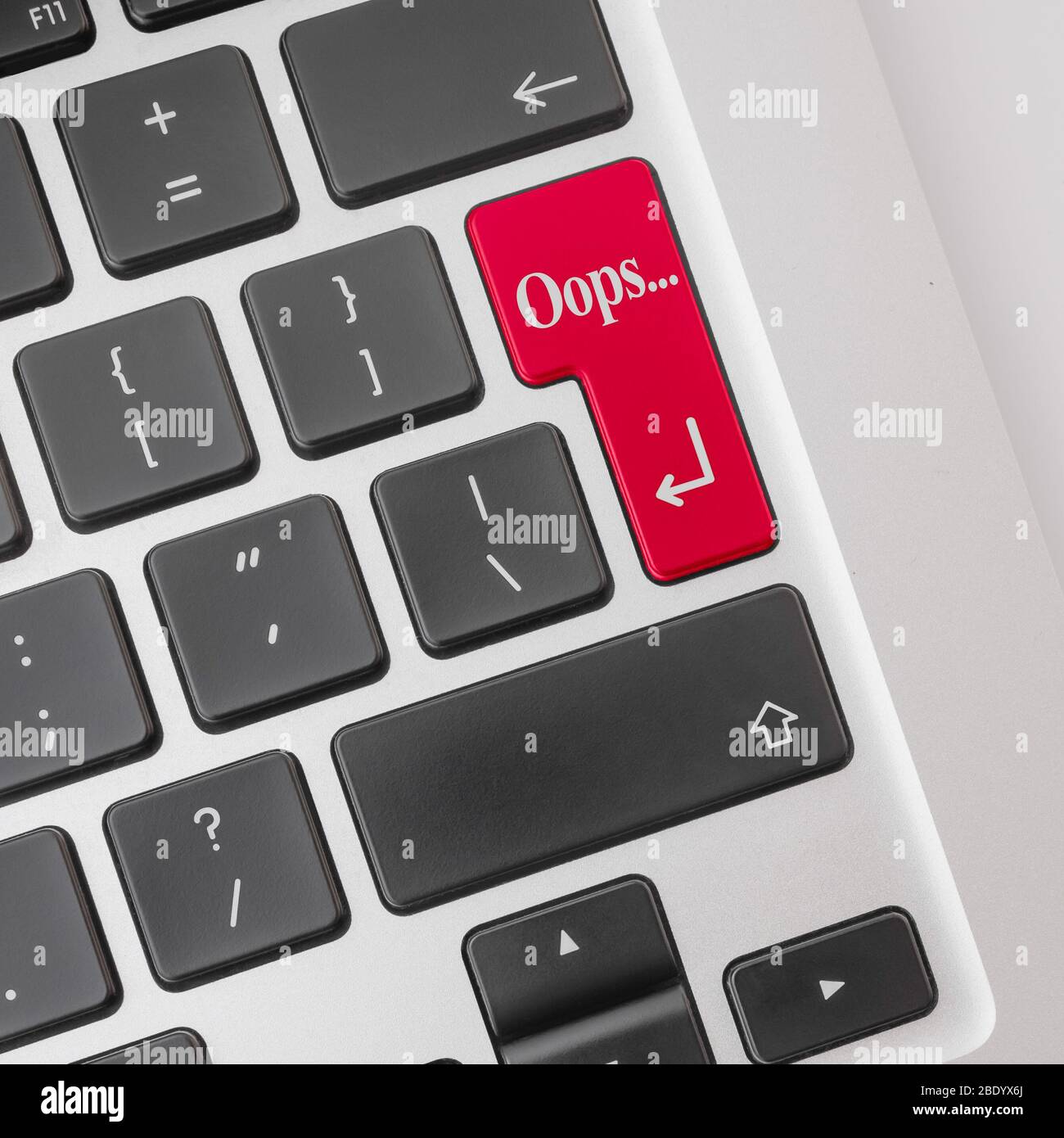 Oops on a red key on computer keyboard Stock Photo - Alamy