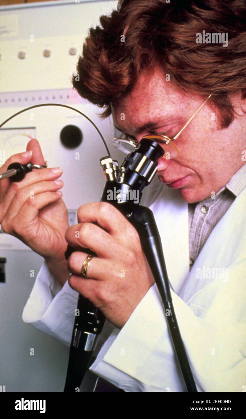 Doctor looking through endoscope hi-res stock photography and images ...
