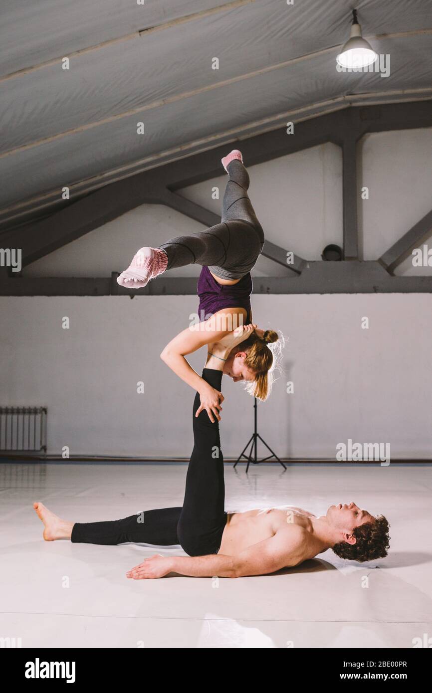Theme sport and a healthy lifestyle. Acrobatics and acroyoga. Young ...