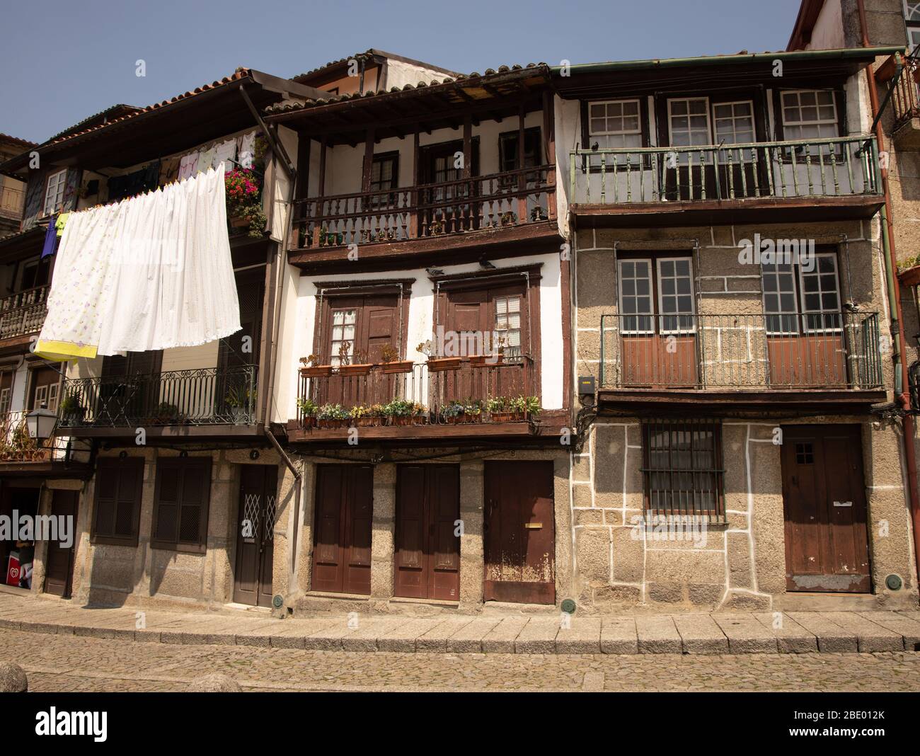 Row of well-preserved terraced medieval houses in the historic town ...