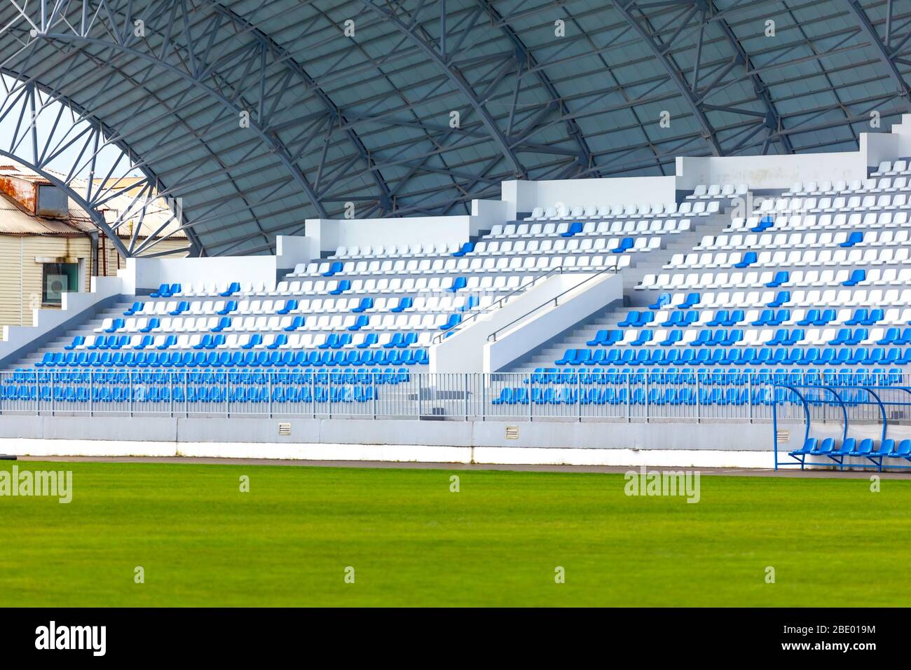 blue and white rows of seats on the stadium Stock Photo - Alamy