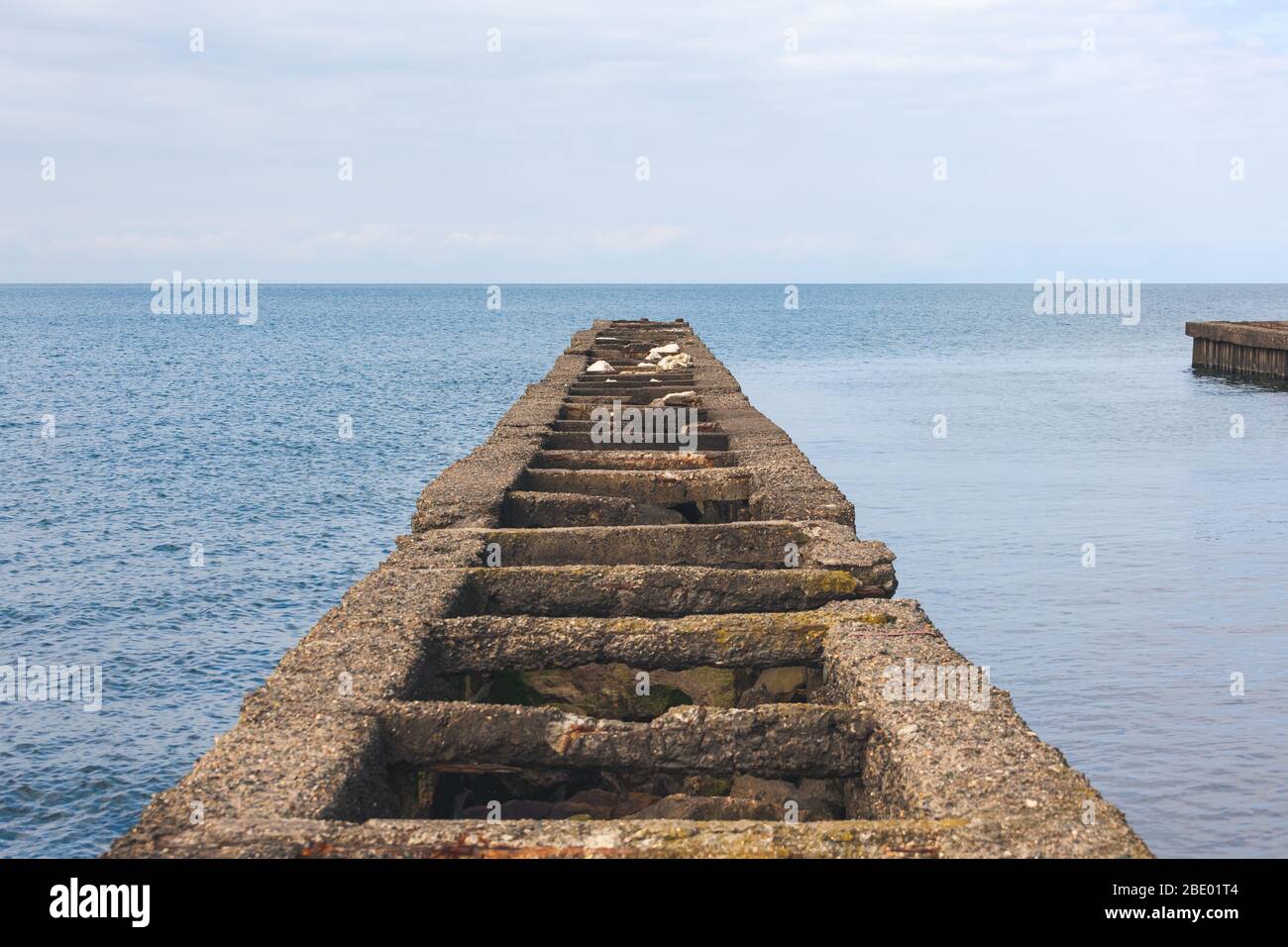 old and broken concrete pier into the sea, Poti, Georgia Stock Photo ...