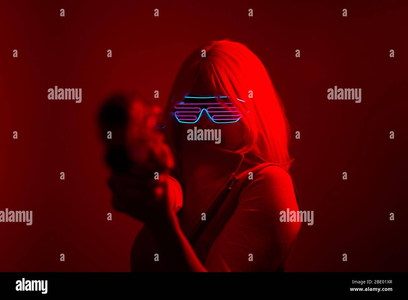 Girl with blaster in the futuristic battle. Concept virtual reality ...