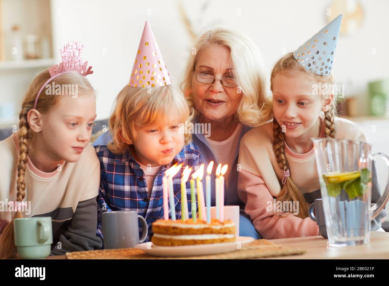 Happy grandmother celebrating her birthday together with her ...