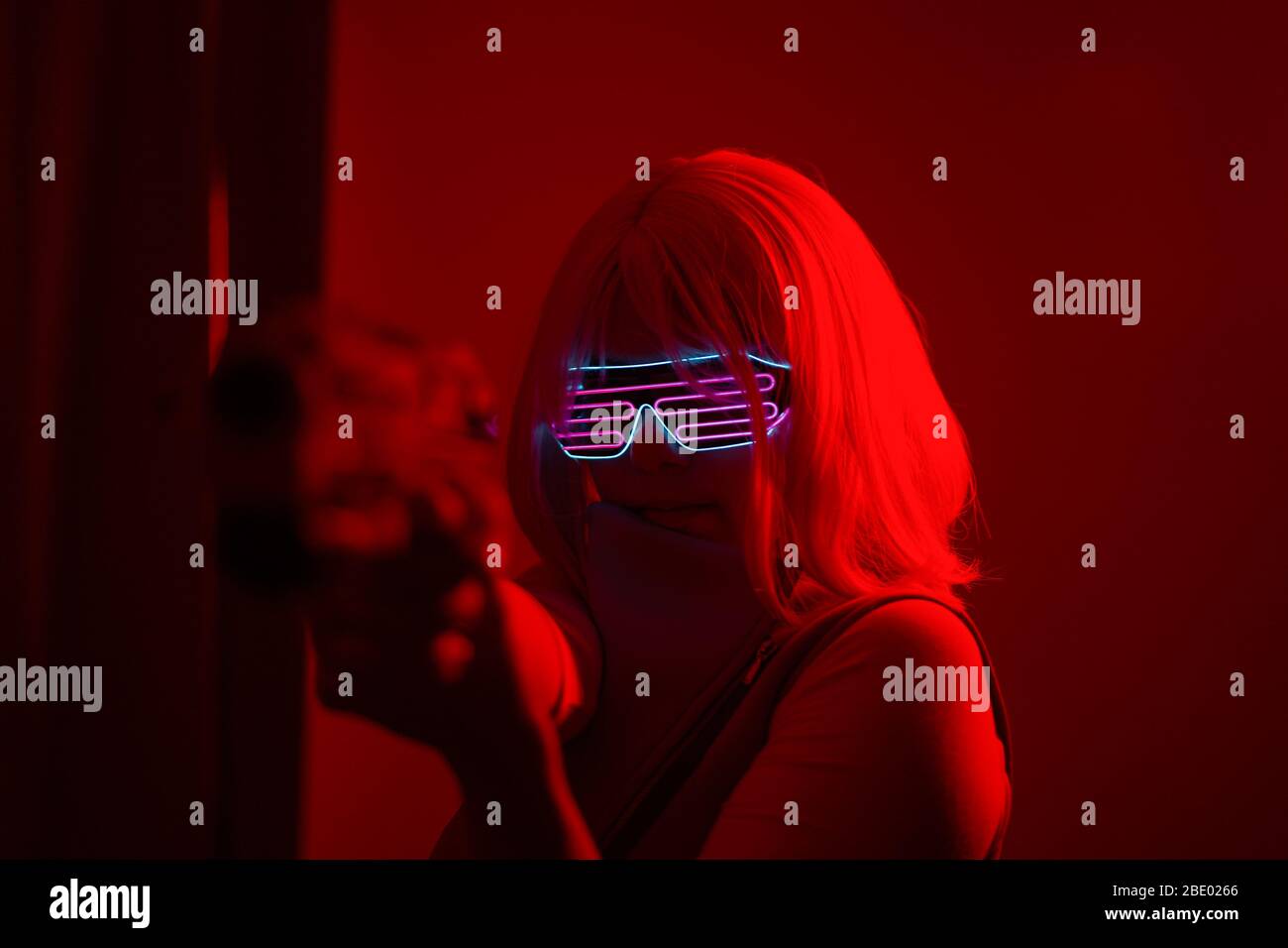 Girl with blaster in the futuristic battle. Concept virtual reality ...