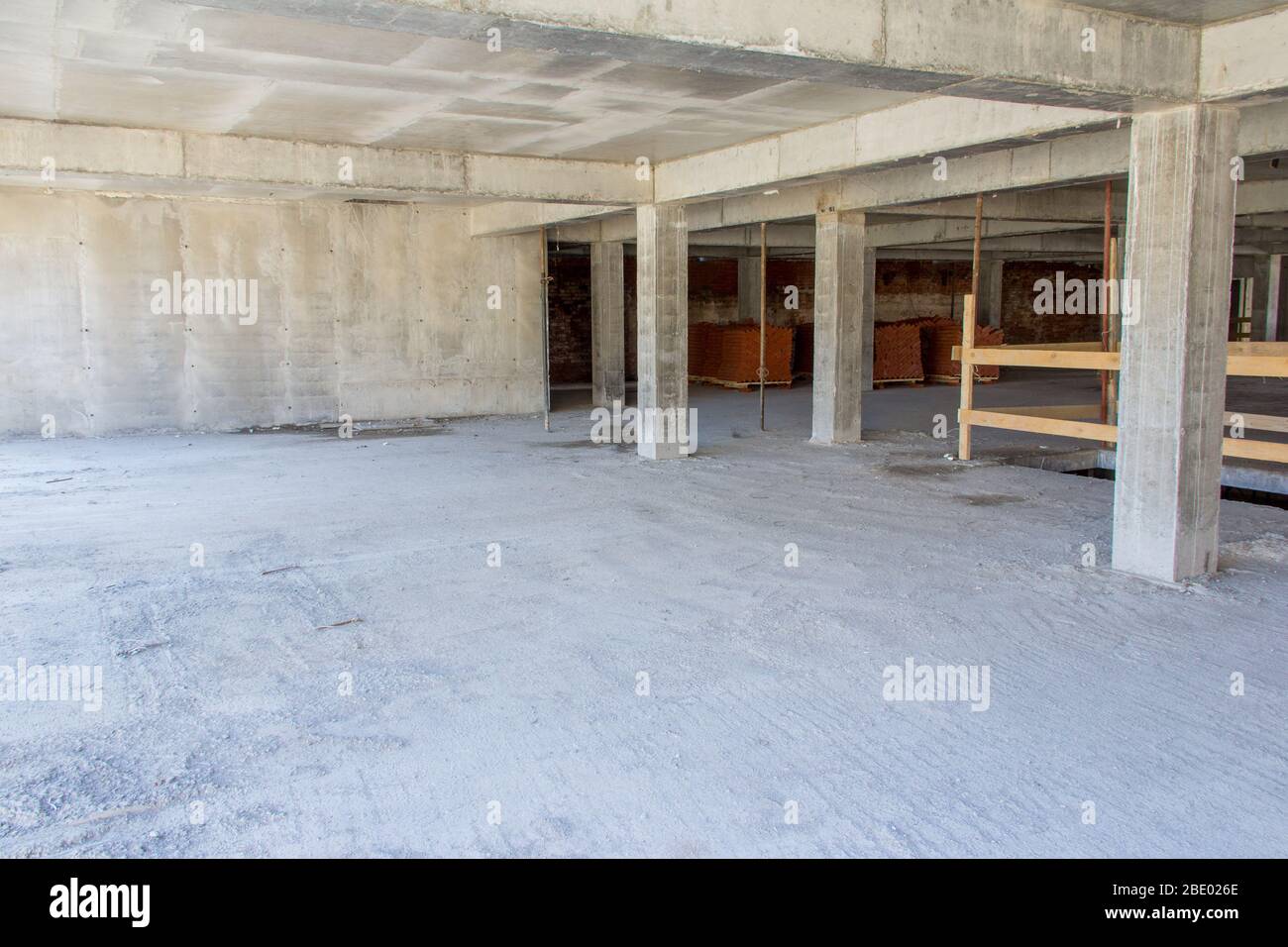 Concrete colums on the floor of a building under construction. Concrete ...