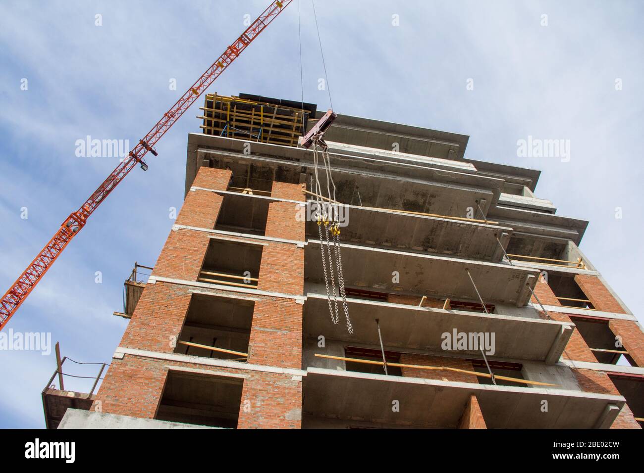 The facade of the building under construction is made of concrete frame ...