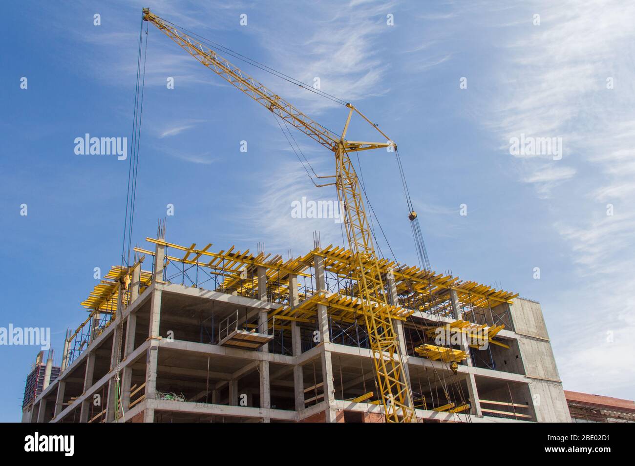 The facade of the building under construction is made of concrete frame ...