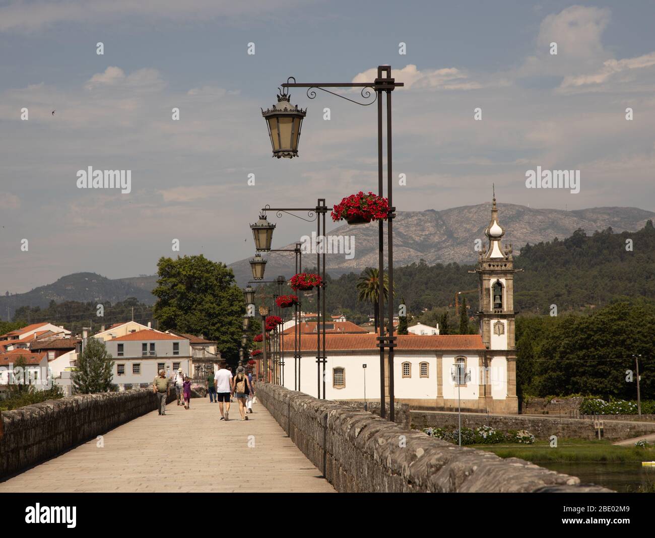 Scenic view of the Ponte Medieval bridge with people walking and white ...