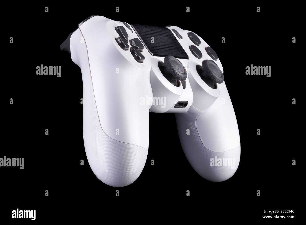 White video game joystick gamepad isolated on a black background Stock ...