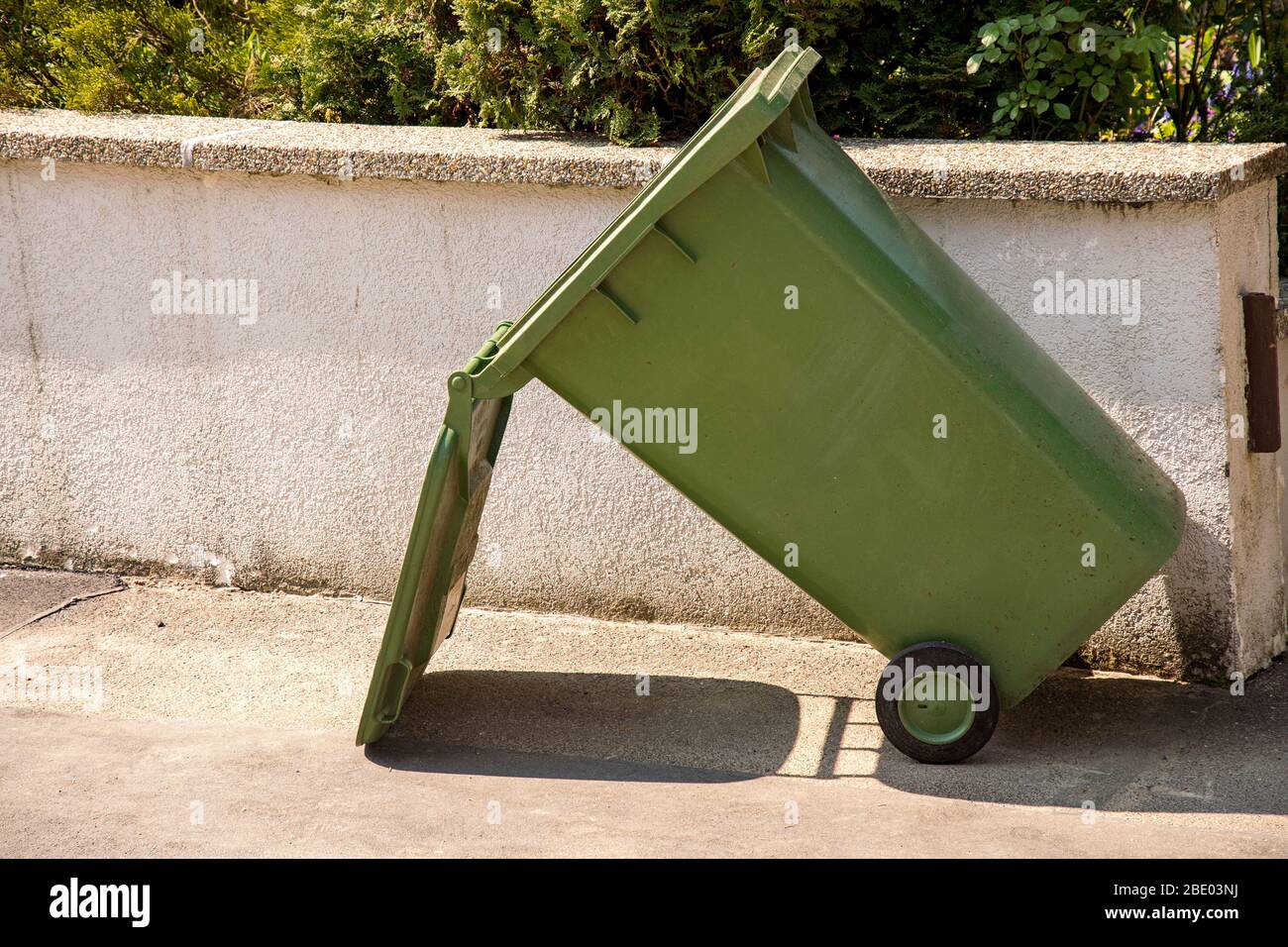 green dustbin clays opened for cleaning on the street Stock Photo - Alamy