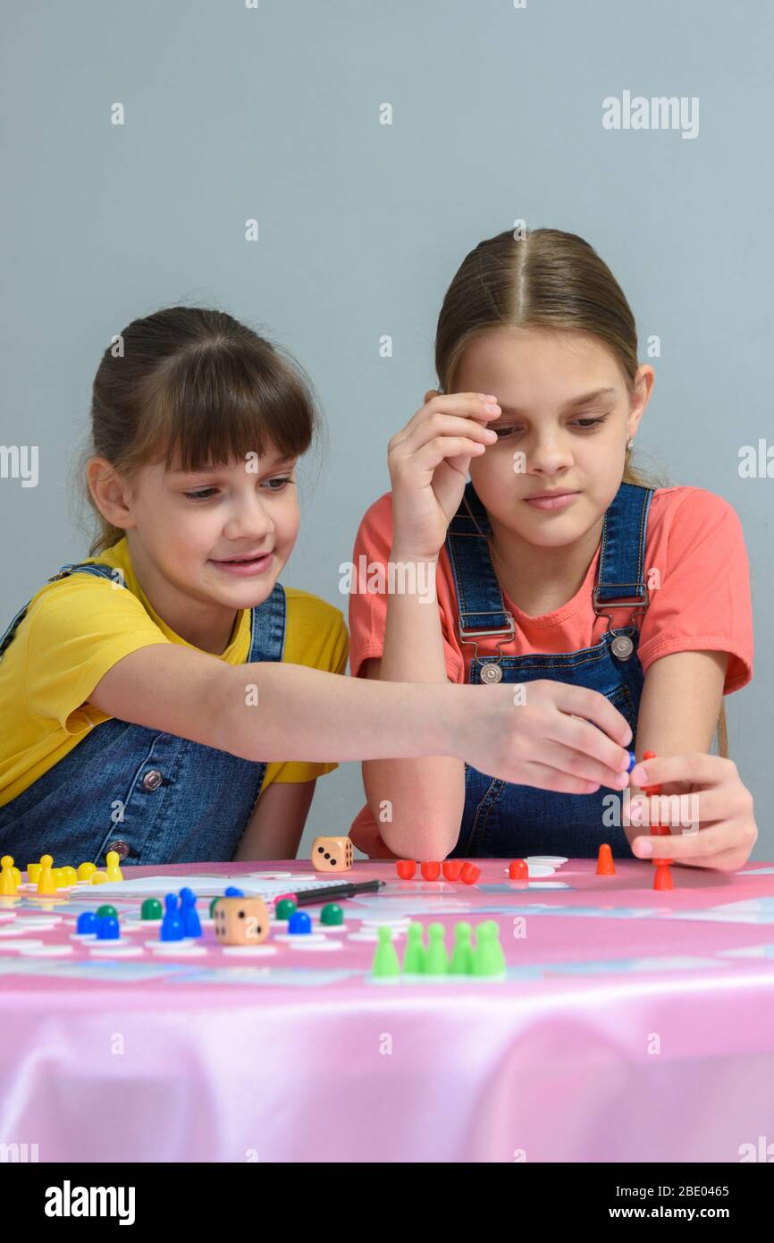 Two girls playing cards hi-res stock photography and images - Alamy