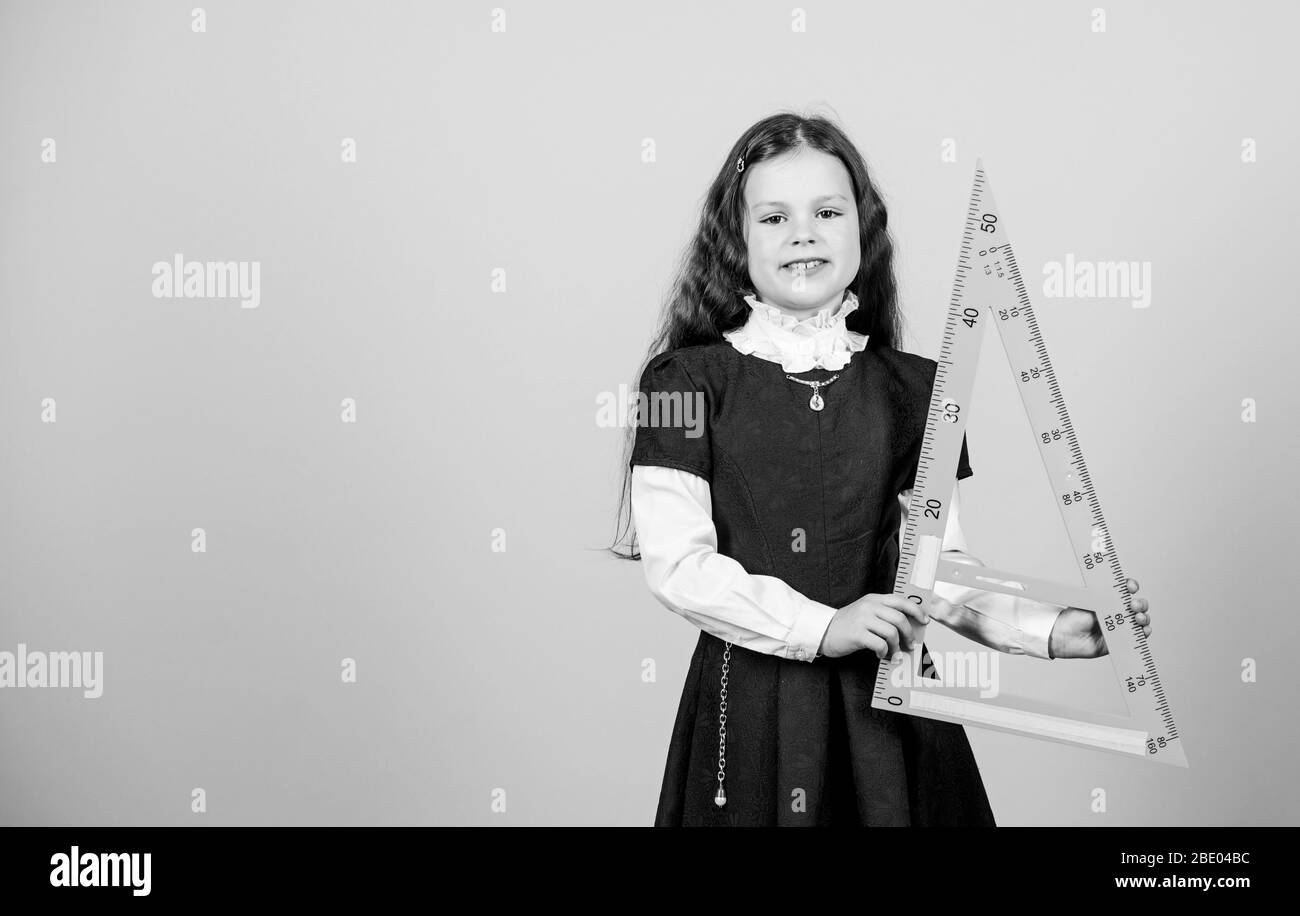 Kid school uniform hold ruler. I love mathematics. Education and school ...