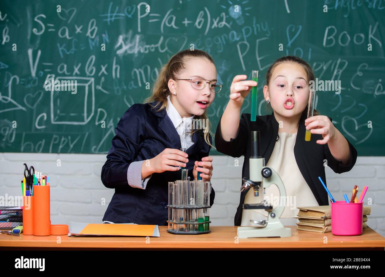 Hard choice. Chemistry research. Biology science. Happy little girls ...