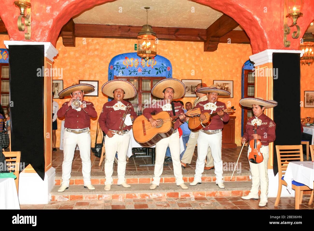Music group singing in a restaurant in Mexico Stock Photo - Alamy
