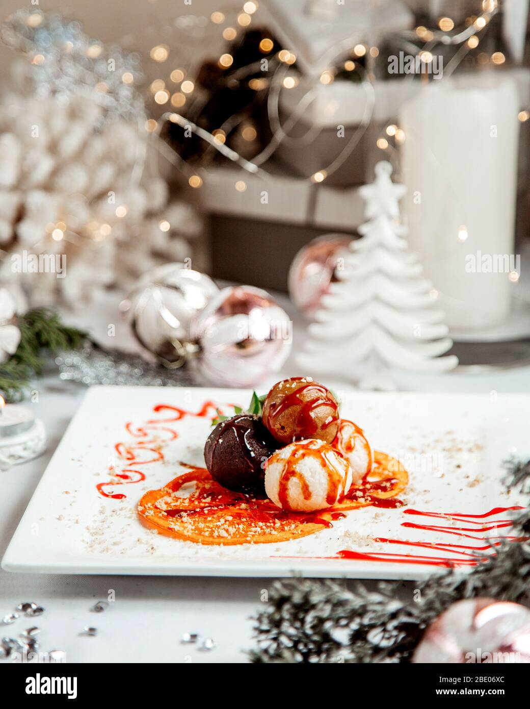 dessert balls topped with fruit syrup Stock Photo - Alamy