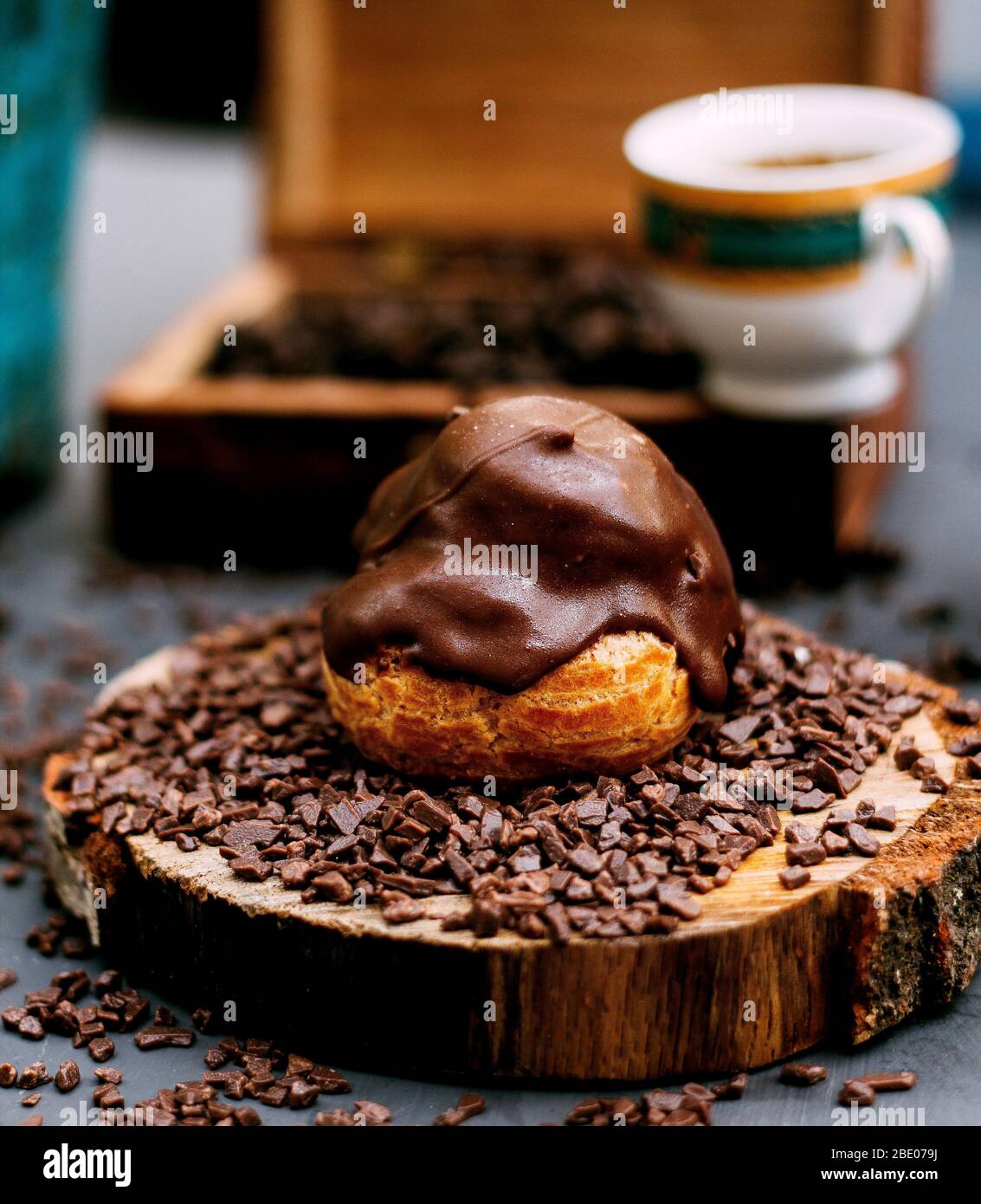 eclair topped with melted chocolate Stock Photo - Alamy