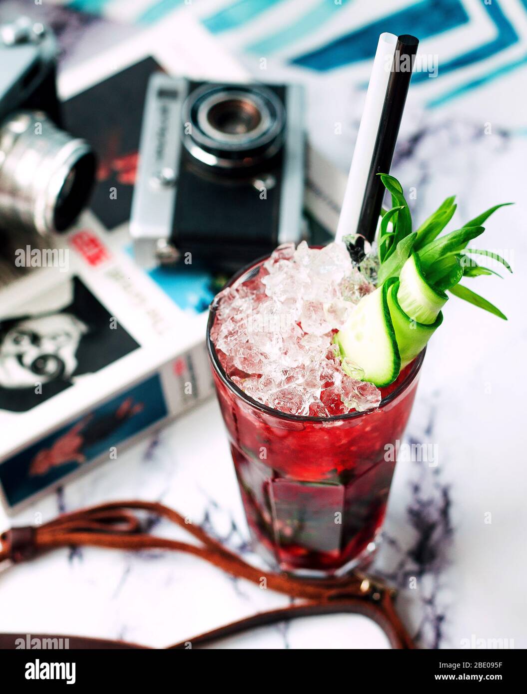juice with crushed ice and sliced cucumber on top Stock Photo - Alamy