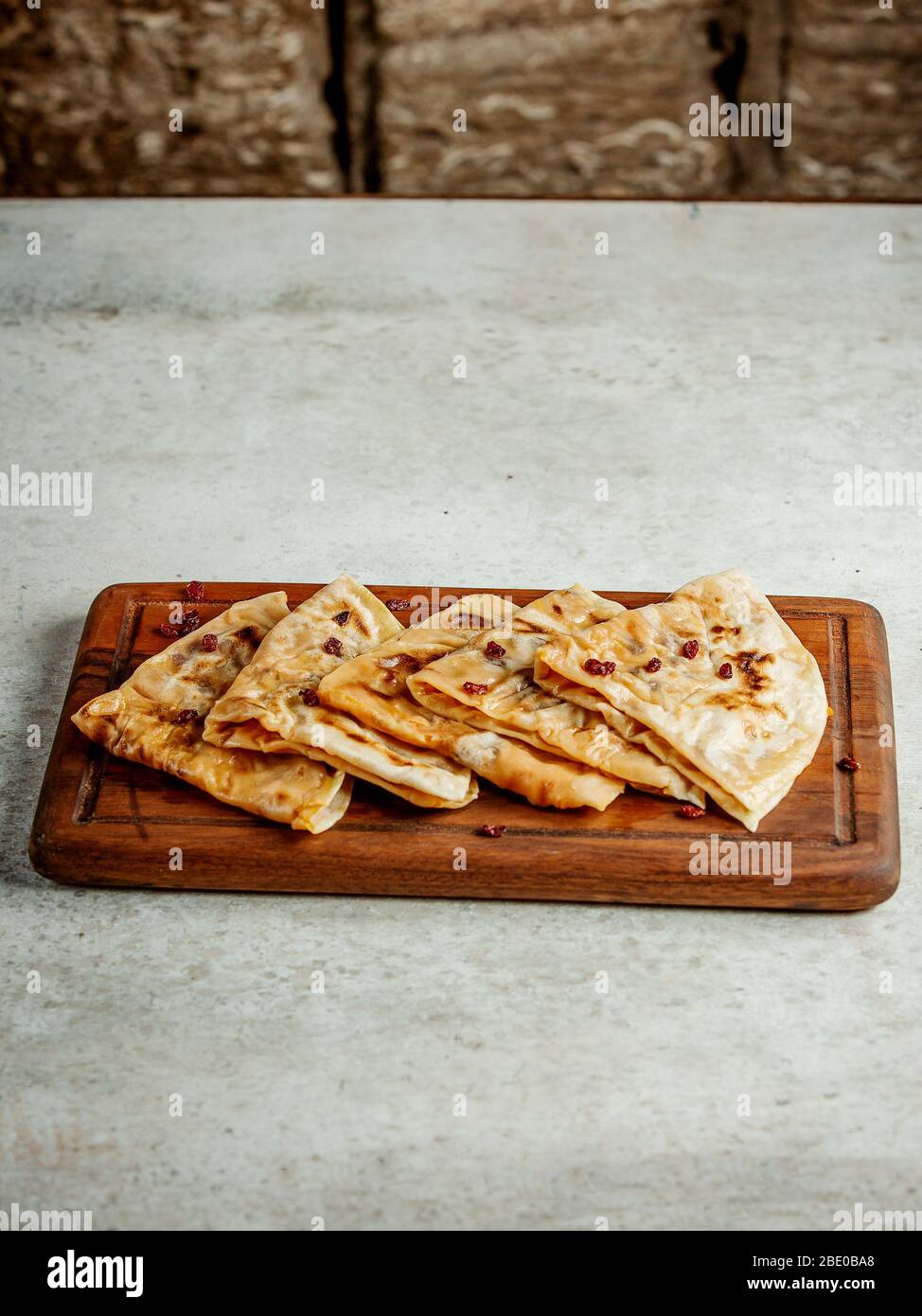 qutabs with meat and sumakh Stock Photo - Alamy