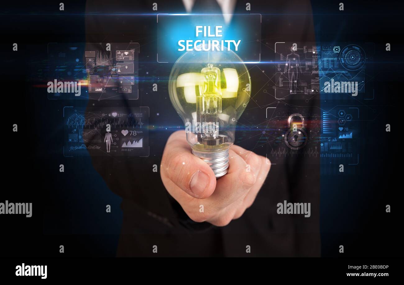 Businessman holding lightbulb with FILE SECURITY inscription, online ...