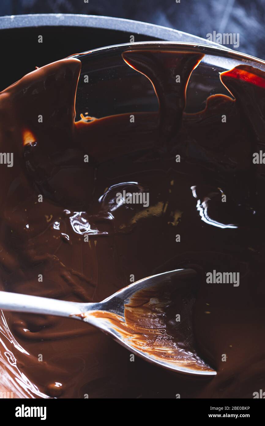 Spoon drowning on chocolate cream Stock Photo - Alamy