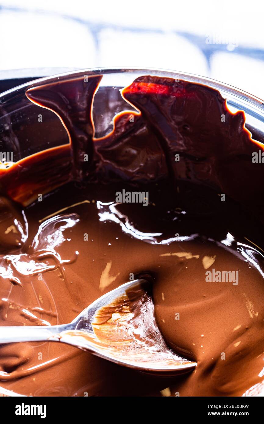 Spoon drowning on chocolate cream Stock Photo - Alamy