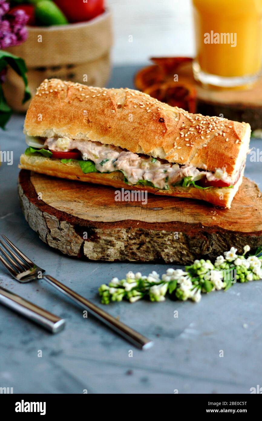 sandwich on the desk with orange juice Stock Photo - Alamy