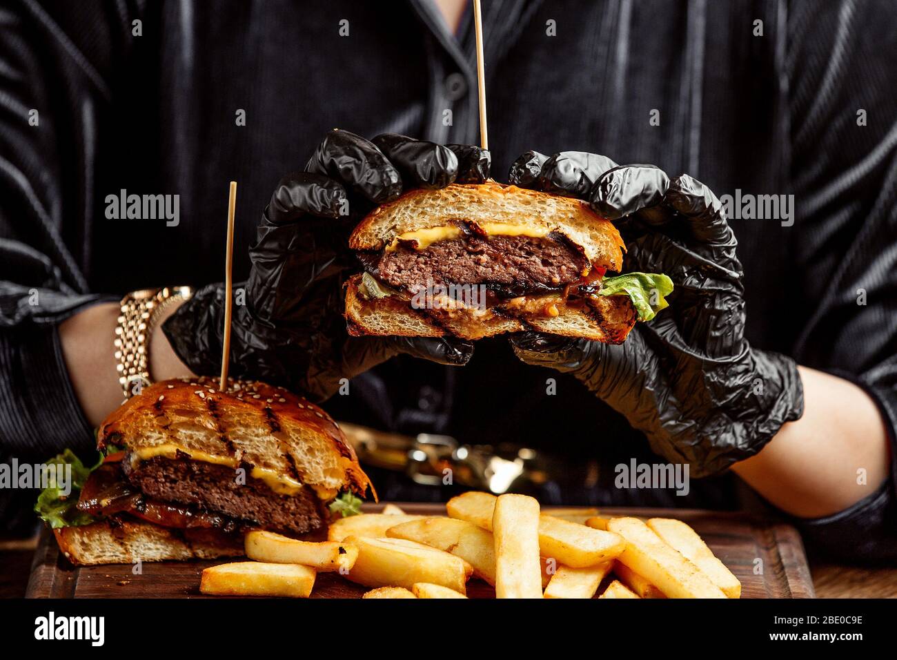 sliced grilled cheeseburger with fried potato Stock Photo - Alamy