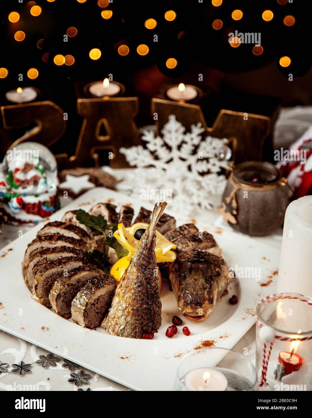 sliced fish with filling and lemon Stock Photo - Alamy