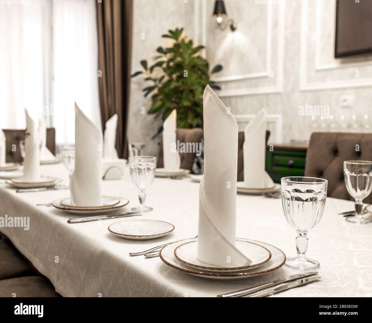 a table with white servant Stock Photo - Alamy