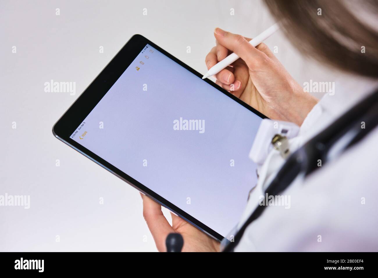 Healthcare worker using tablet to conduct healthcare. doctor or nurse ...
