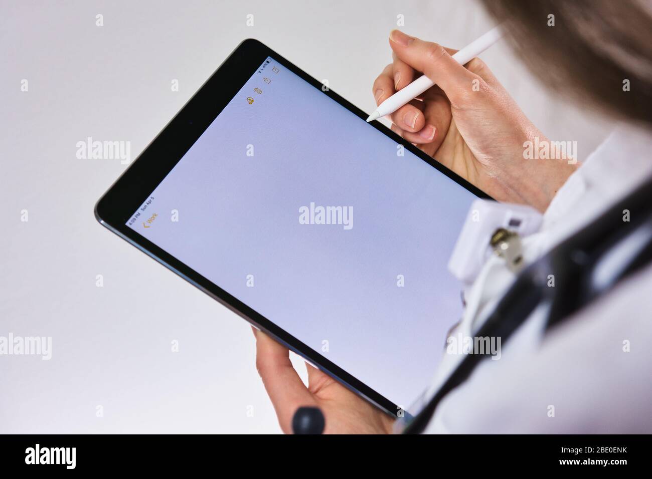 Healthcare worker using tablet to conduct healthcare. doctor or nurse ...