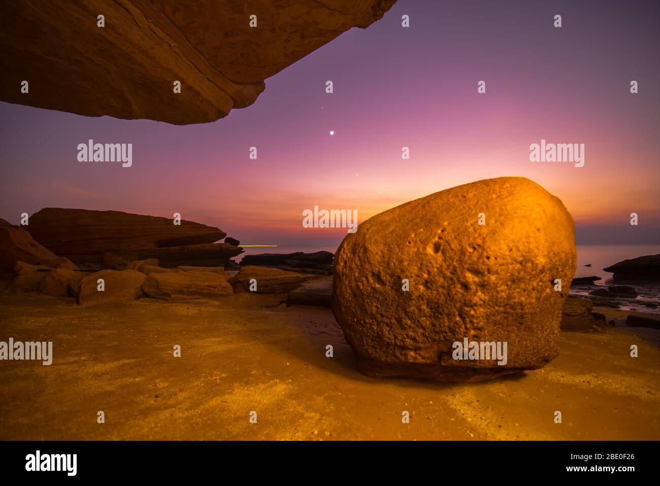 Sunset view - sea cave Stock Photo - Alamy