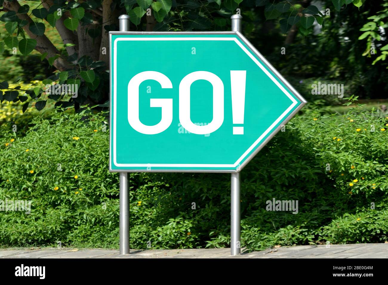 Green road sign - go Stock Photo - Alamy