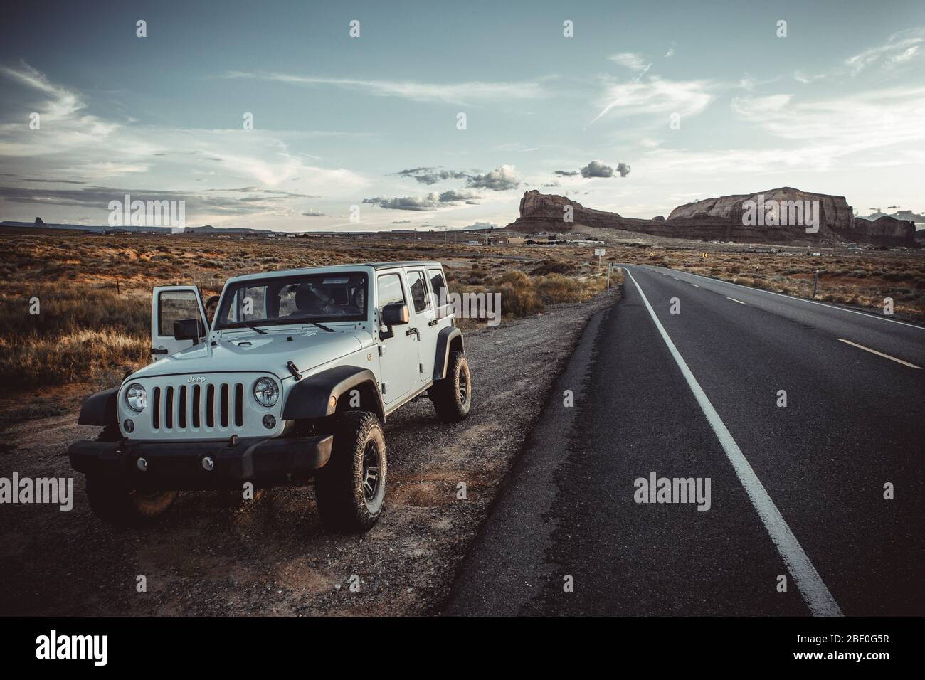 monument valley environment, navajo reservoir and jeep in foreground ...
