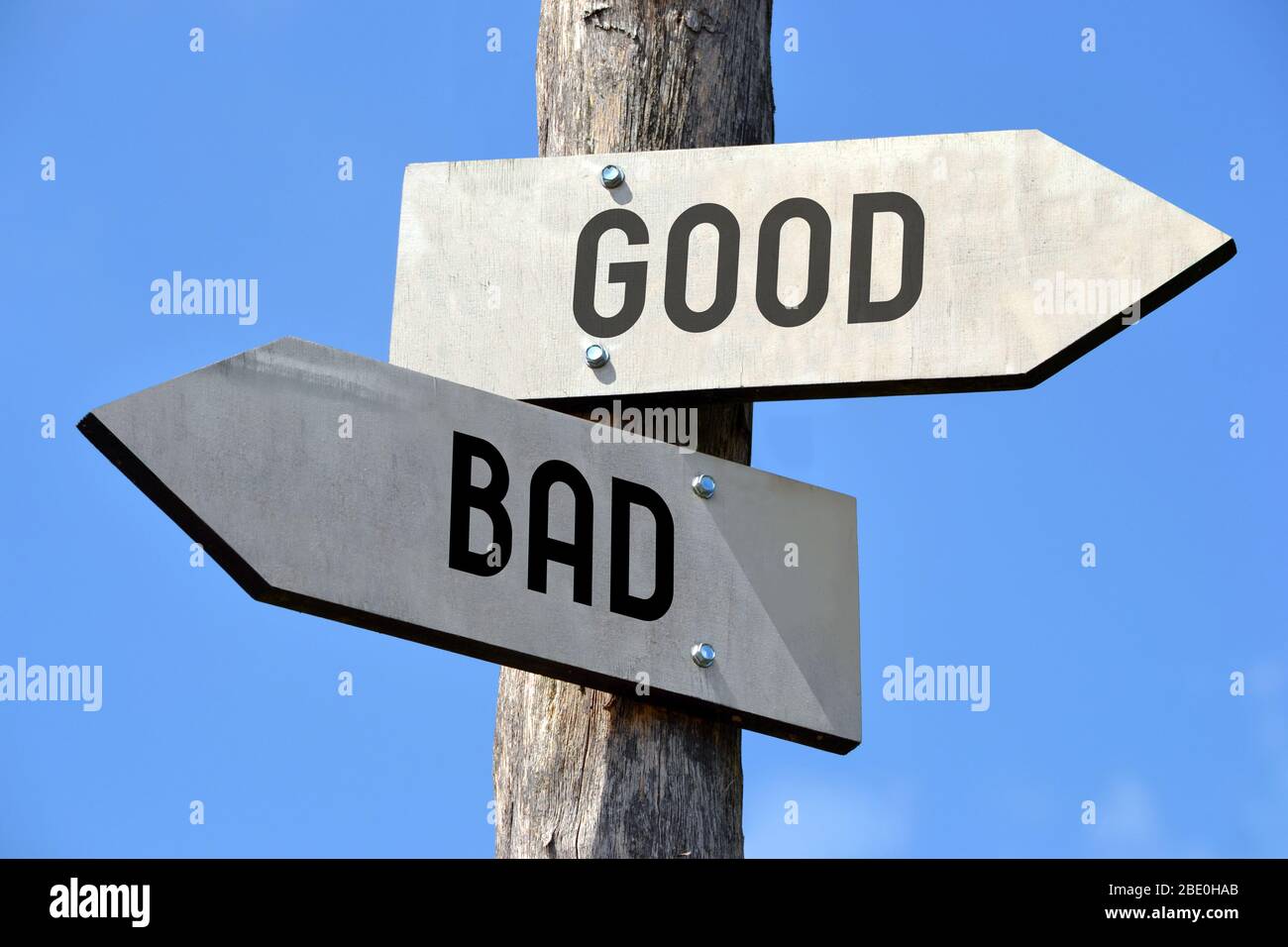 Good and bad signpost Stock Photo - Alamy