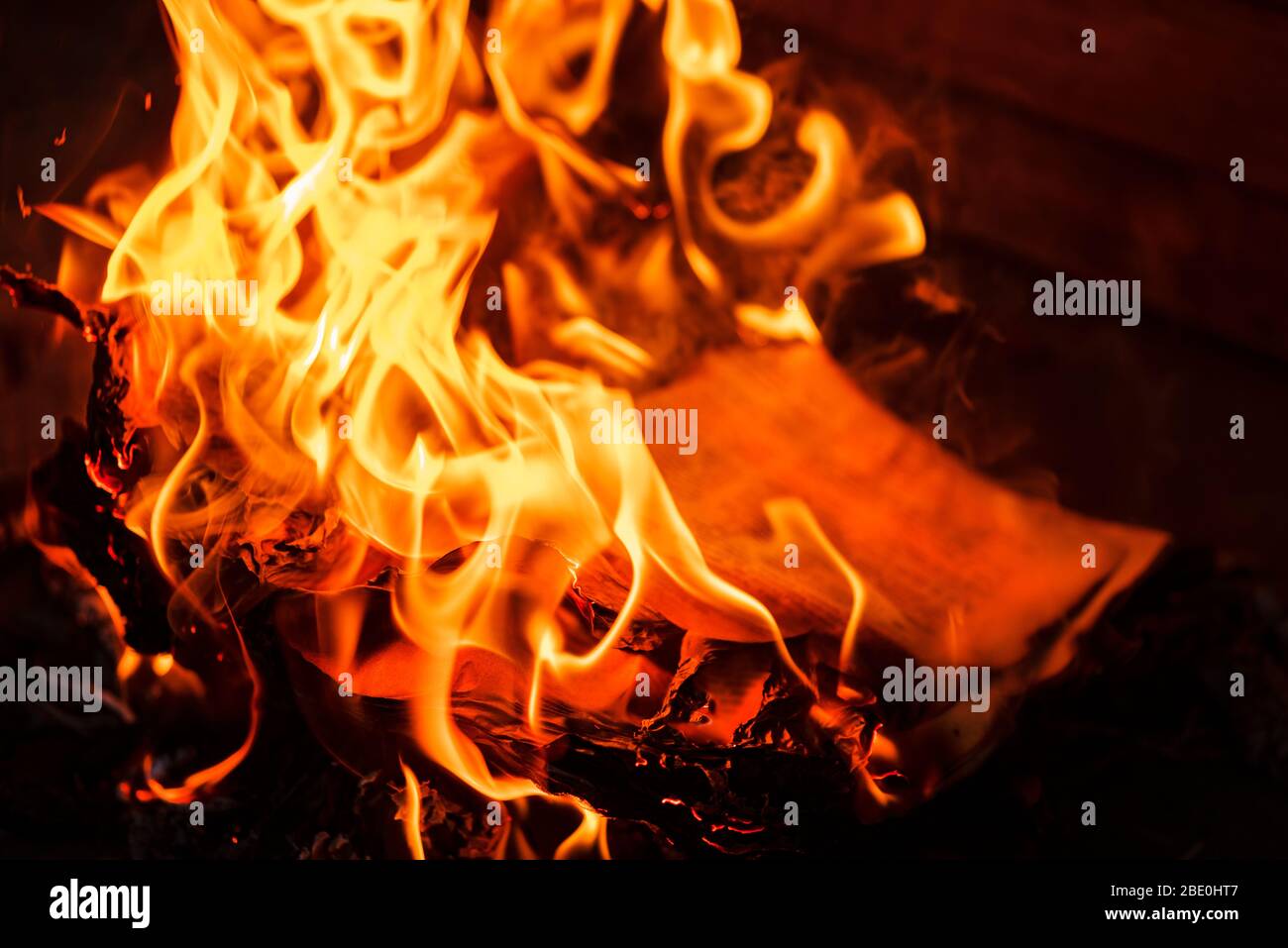Concept for the destruction of confidential documents.Burning book on ...