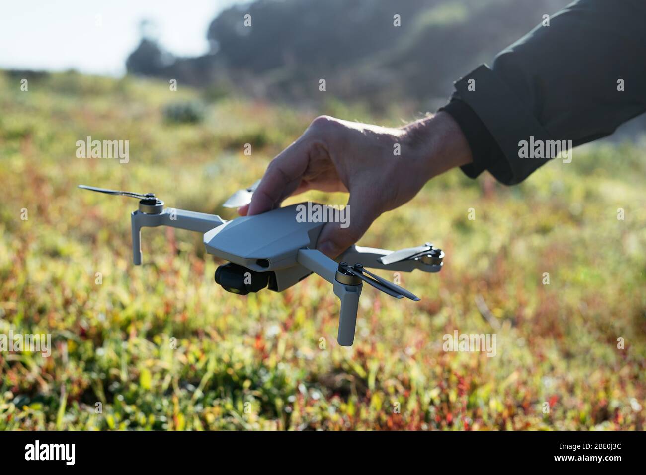Hand putting a drone on the floor Stock Photo - Alamy